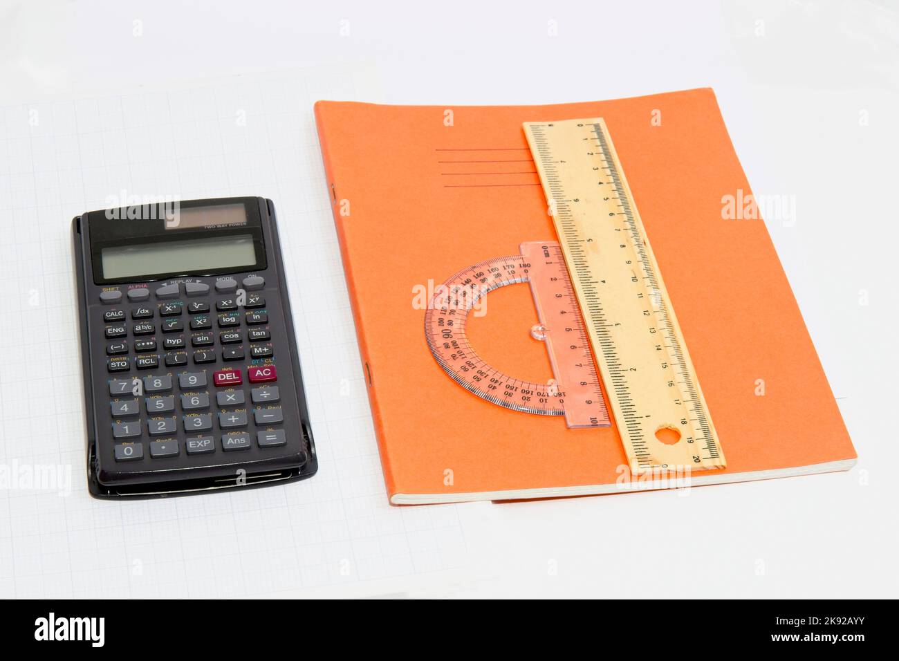 A calculator and notebook to illustrate the concept of education and ...