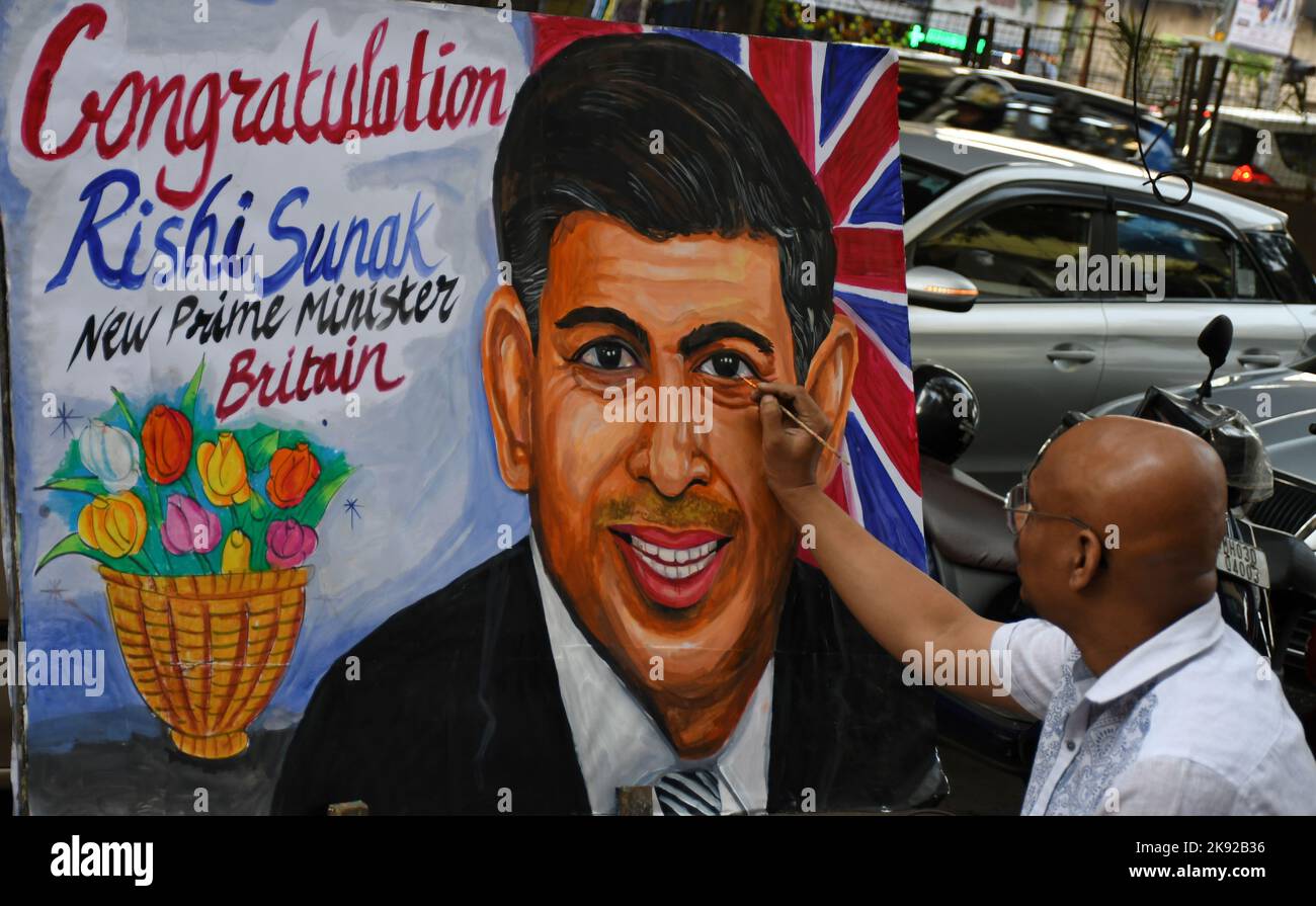 An artist puts finishing touches to the painting of Rishi Sunak at ...