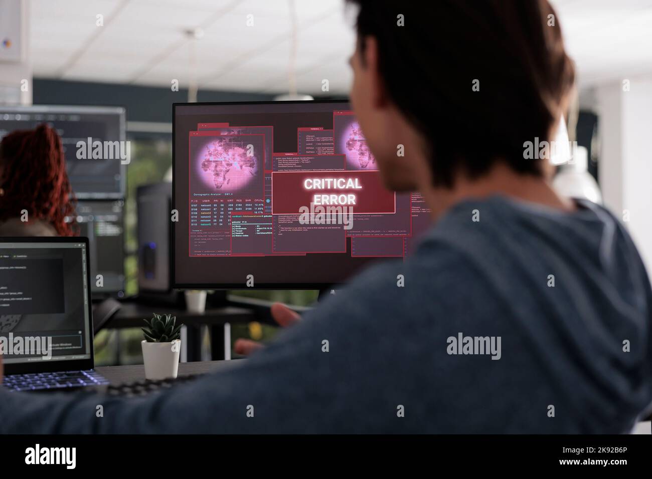 Software Developer Looking At Display Writing Code Encountering Hacking Alert On Computer