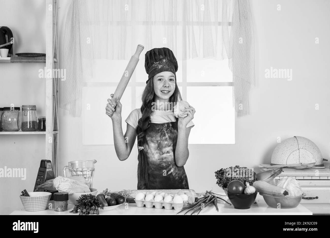 Helpful tools. teen girl chef wearing uniform. child study how to cook ...