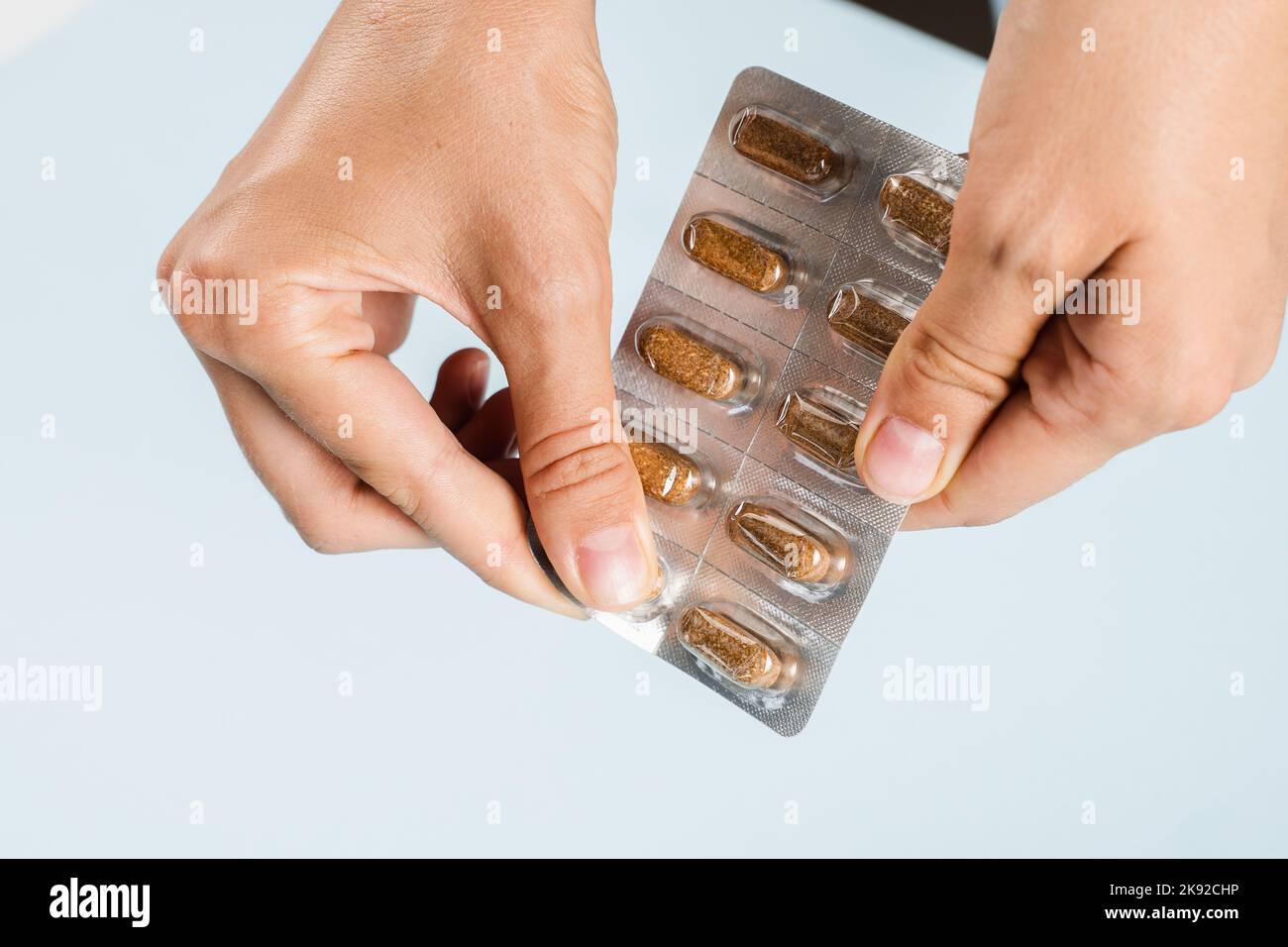 Opening medicine blister hands blister hi-res stock photography and ...