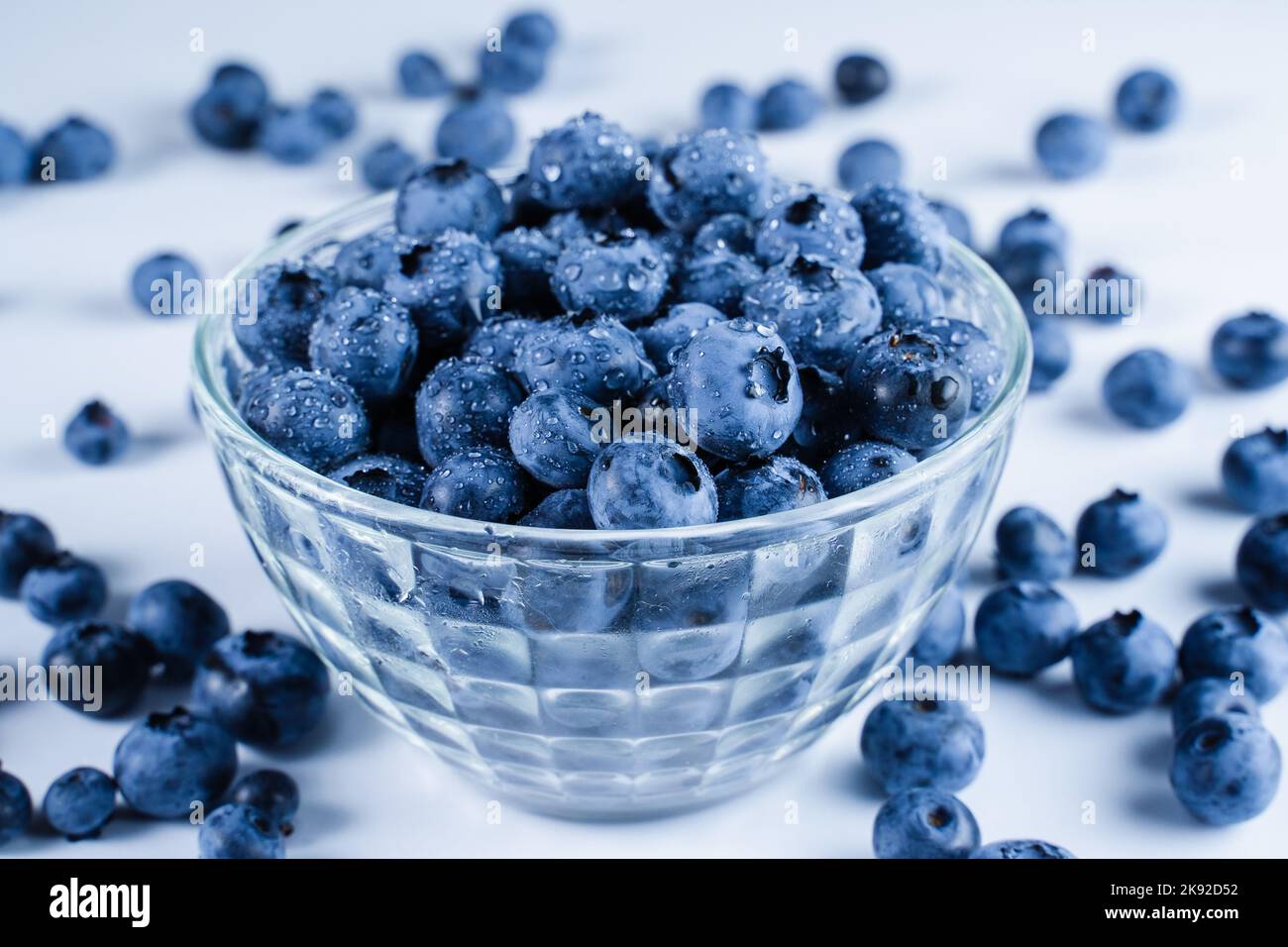 Blueberry with water drops. Blue berries in glass plate on white ...