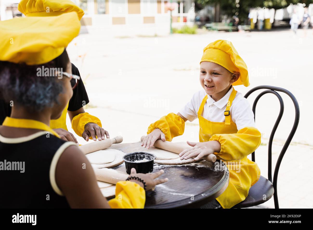 Handsome cook child in yellow chefs hat and apron yellow uniform ...
