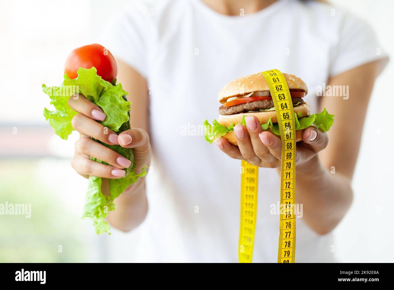 Choose between junk food versus healthy diet Stock Photo - Alamy