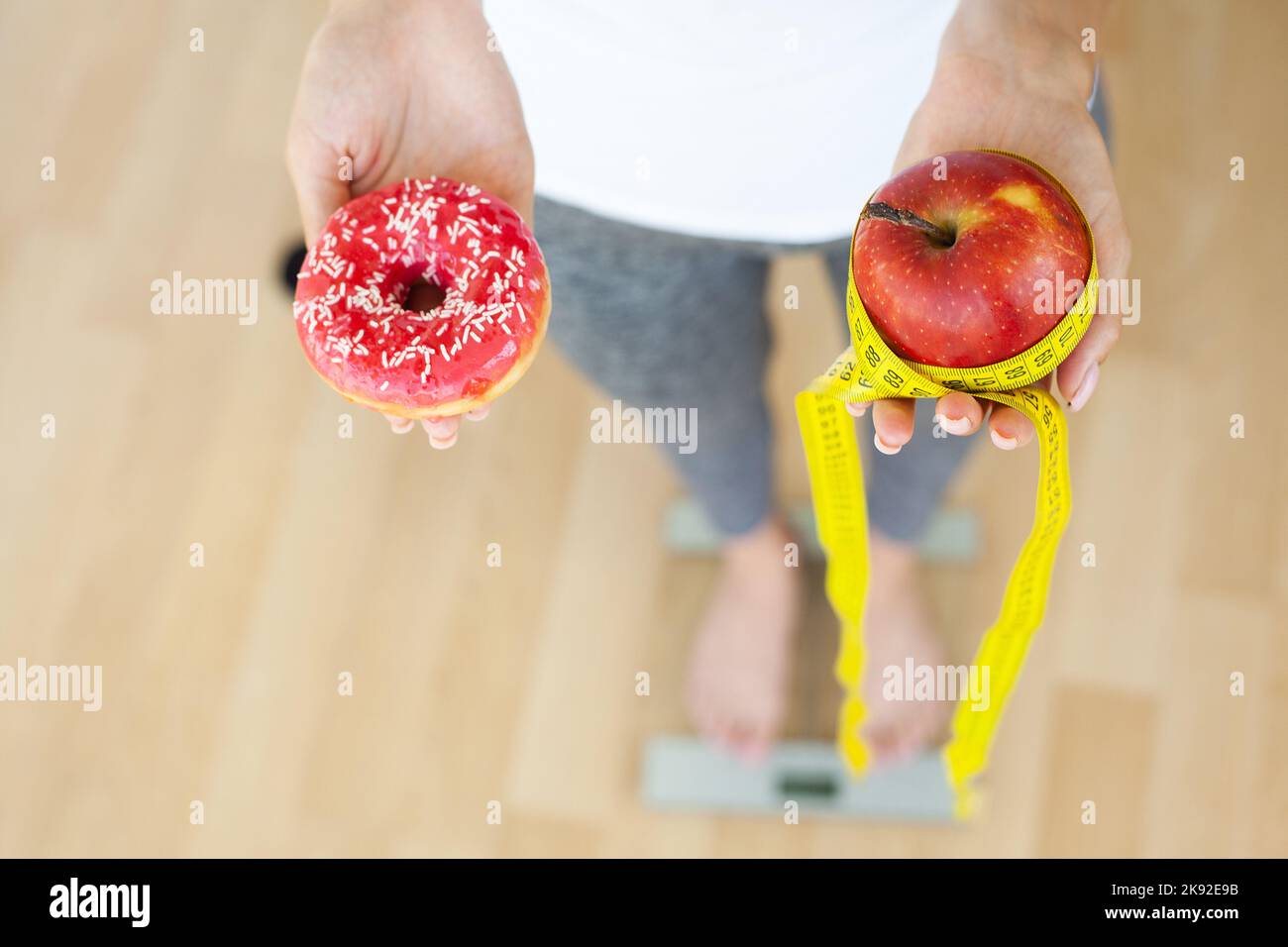 Choose between junk food versus healthy diet Stock Photo - Alamy