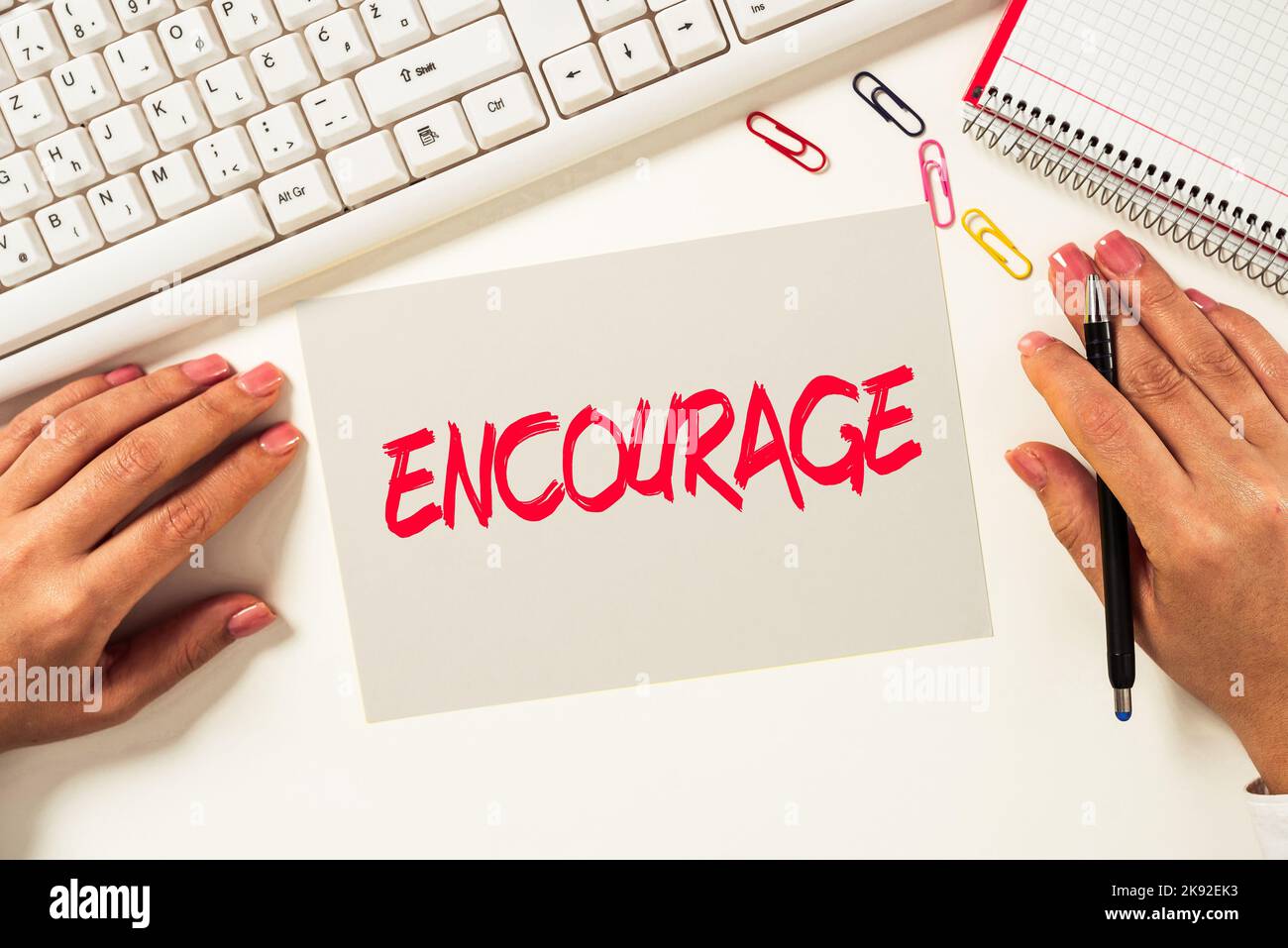 Sign displaying Encourage. Word Written on to inspire with courage ...