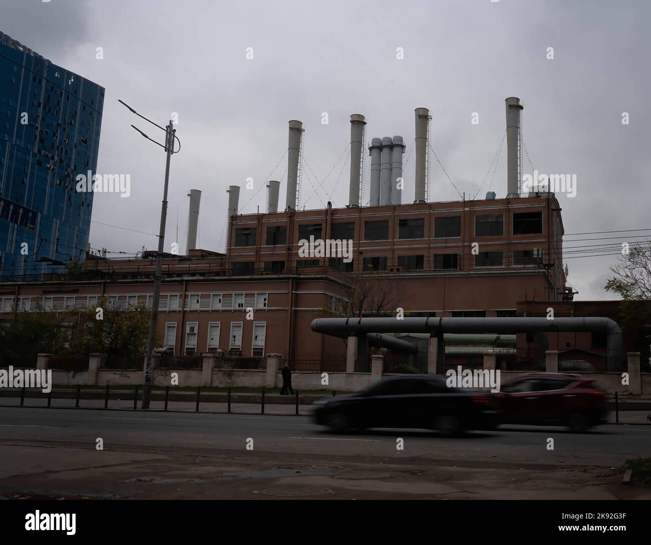Cars drive past an electric utility infrastructure in Kyiv. Ukraine has ...