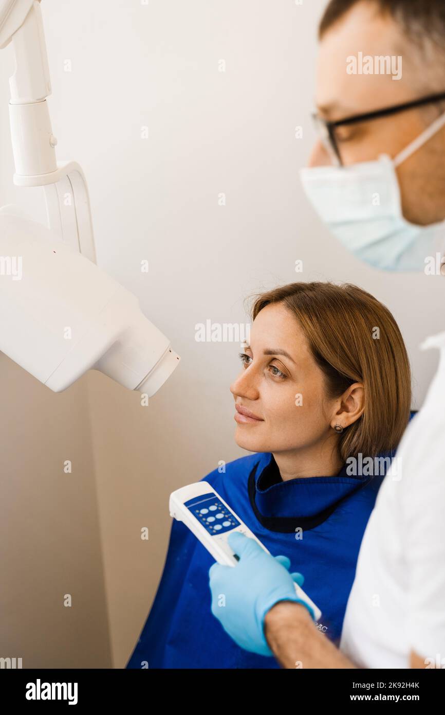 Dentist do x-ray tooth scan for woman in dentistry. Teeth x ray ...
