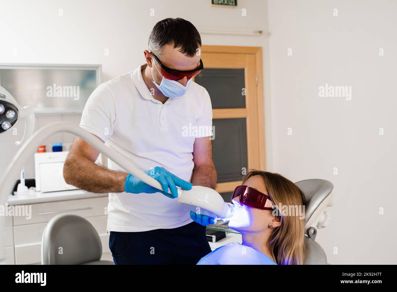 Artificial teeth whitening. Dental ultraviolet whitening treatment with ...