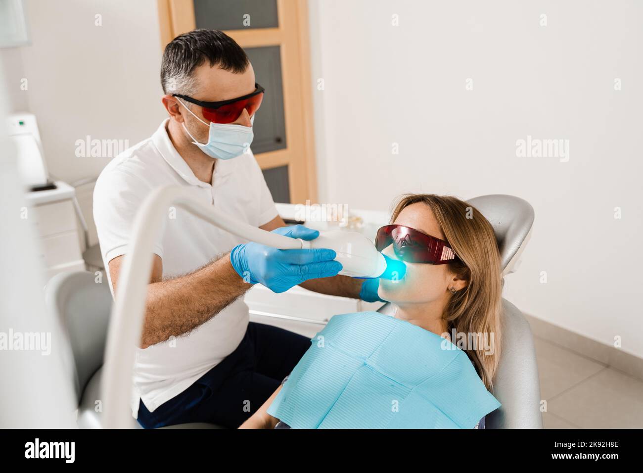 Artificial teeth whitening. Dental ultraviolet whitening treatment with ...