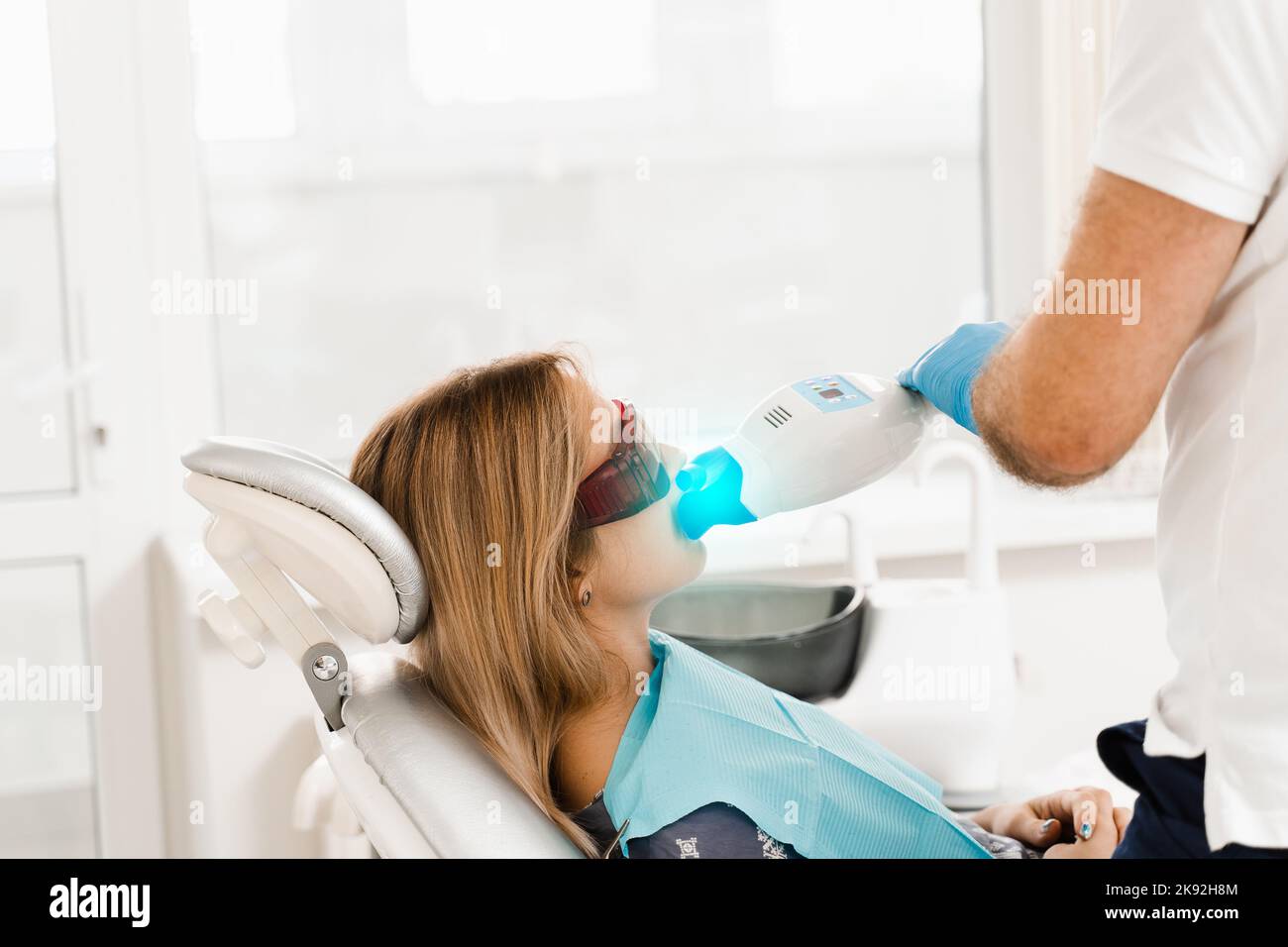 Artificial teeth whitening. Dental ultraviolet whitening treatment with ...