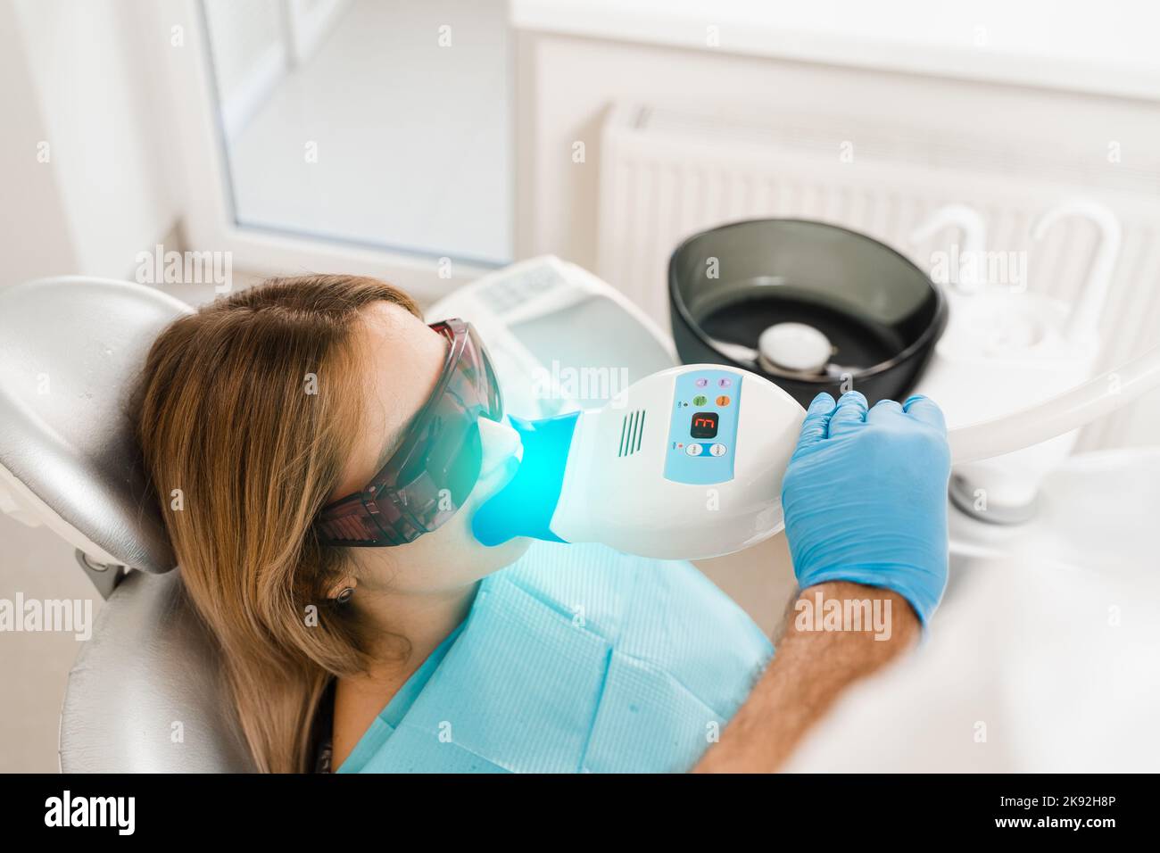 Artificial teeth whitening. Dental ultraviolet whitening treatment with ...