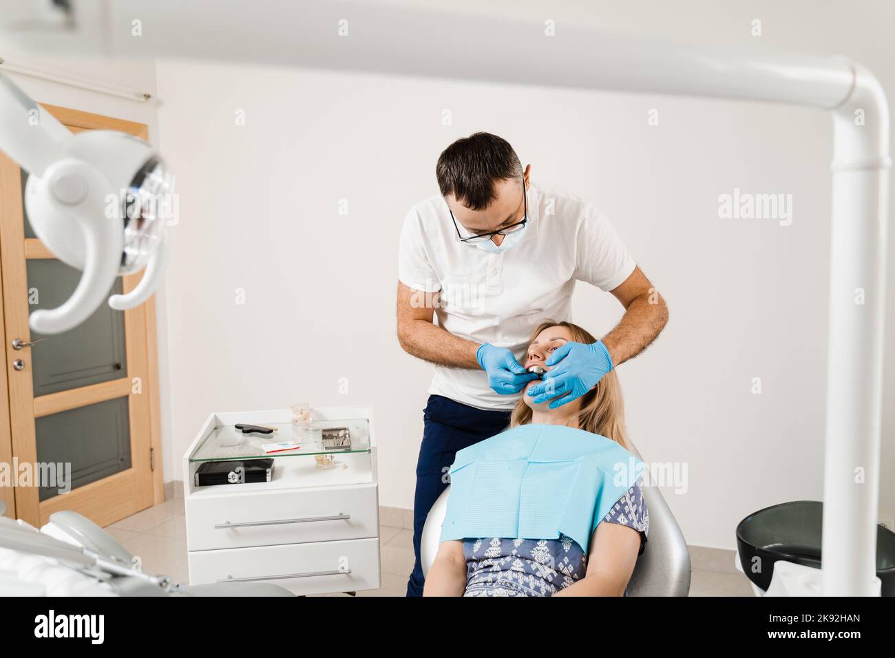 Procedure of creating dental prostheses, crowns and aligners. Doctor ...