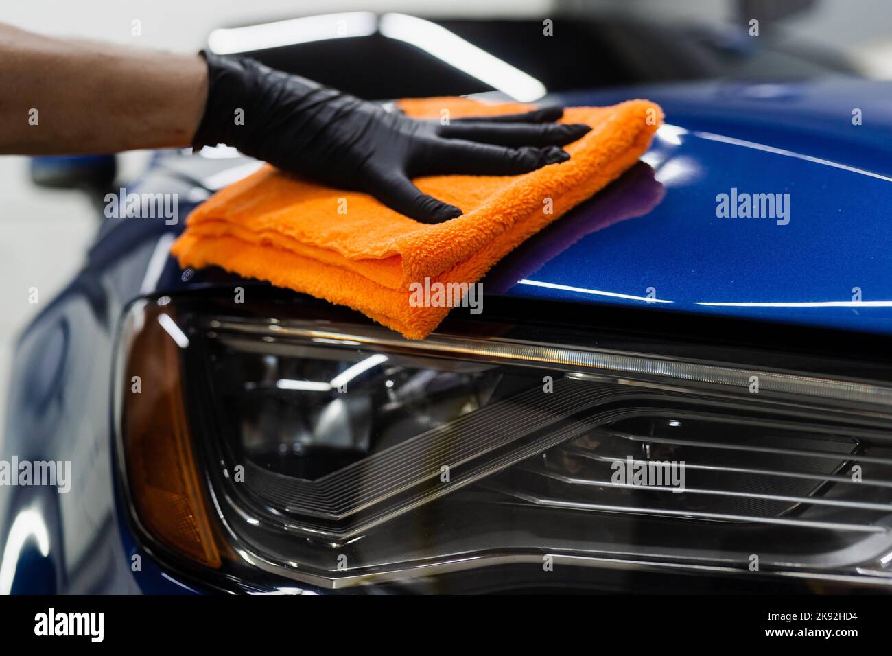 Hand car drying with microfiber in detailing auto service. Cleaner ...