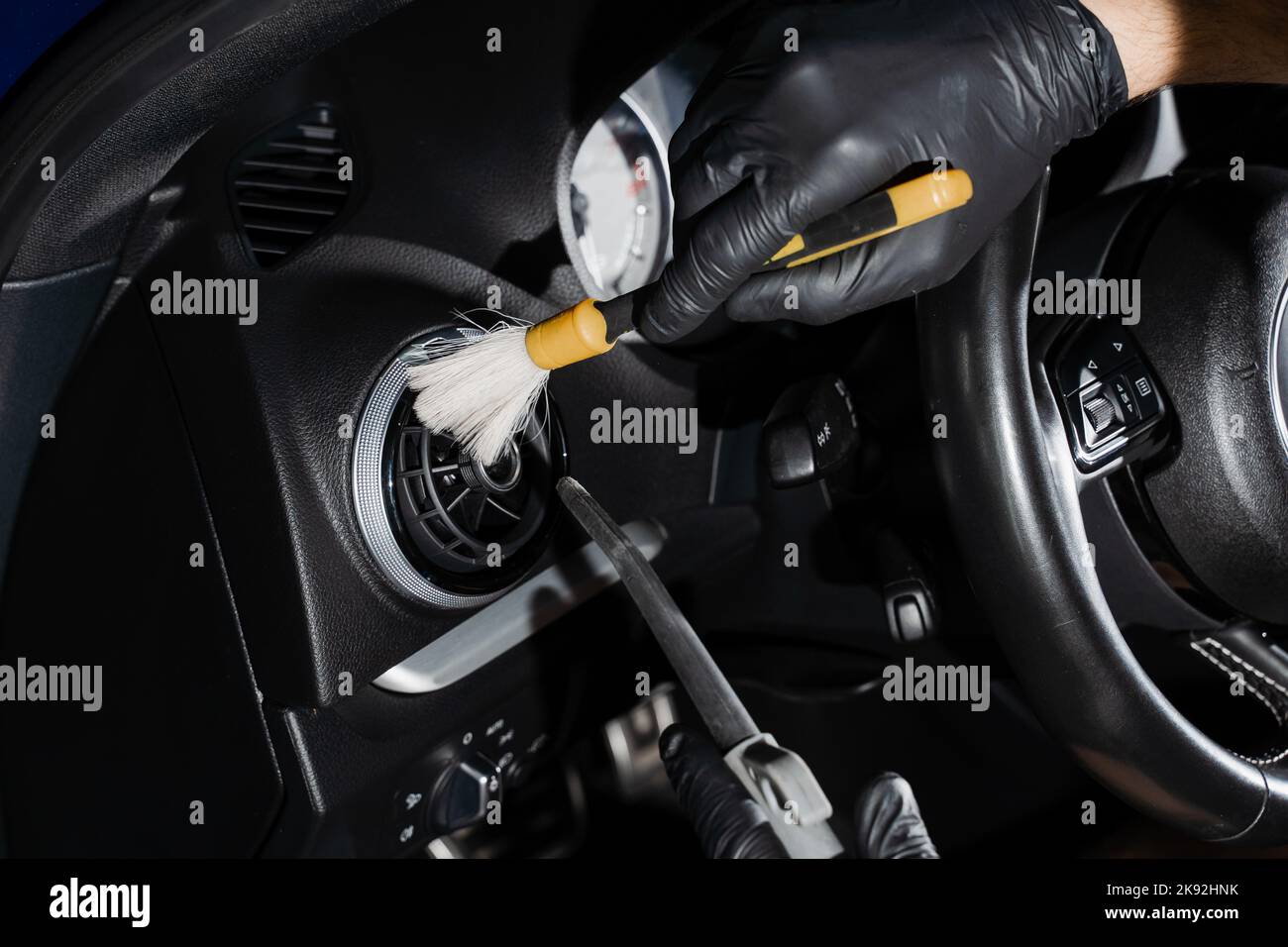 Cleaning with air and brush of air conditioning system in the car ...