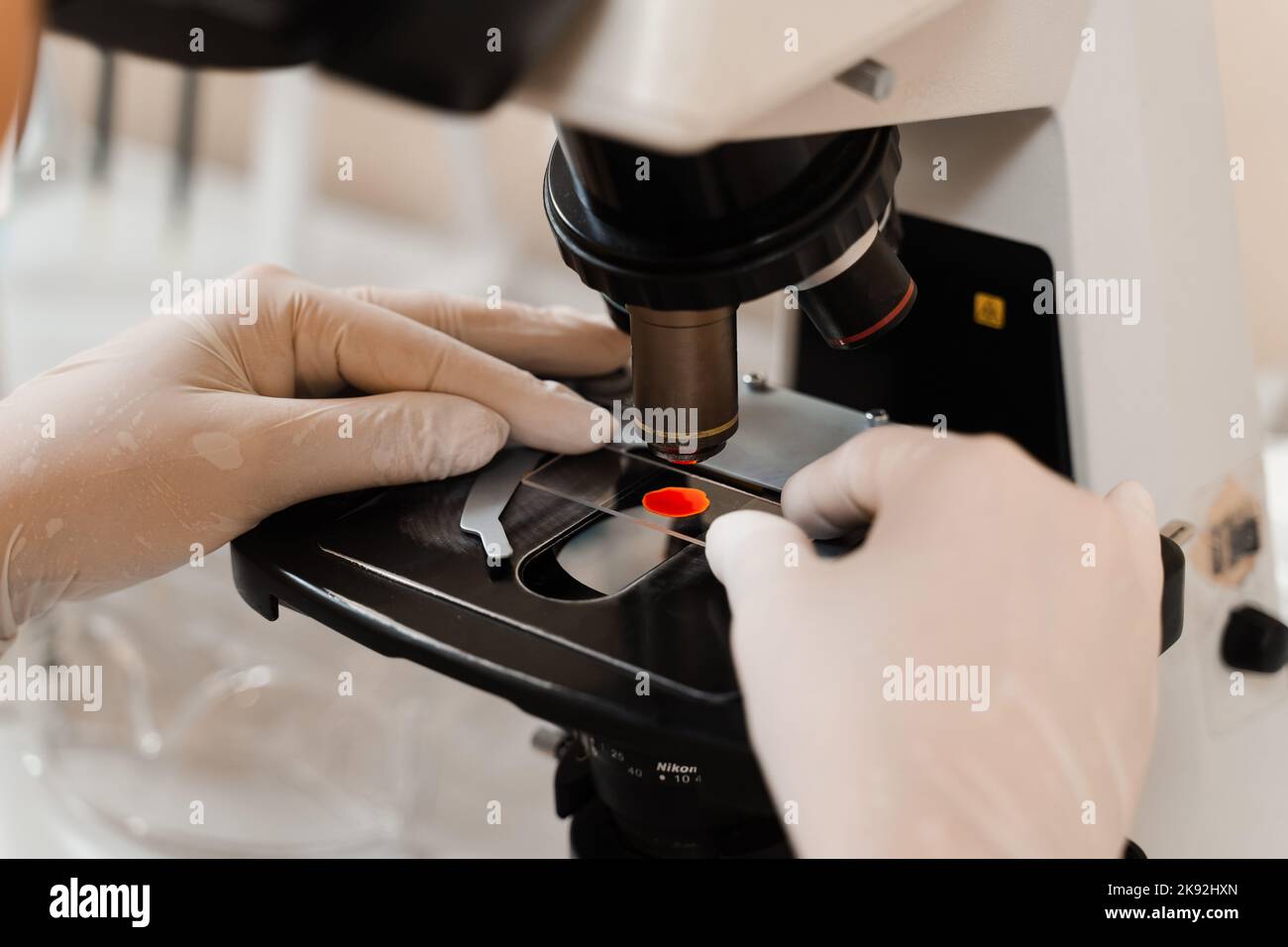 Blood analysis using microscope laboratory close-up. Medical equipment ...