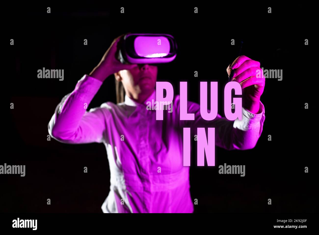 Sign displaying Plug In. Conceptual photo putting device into ...
