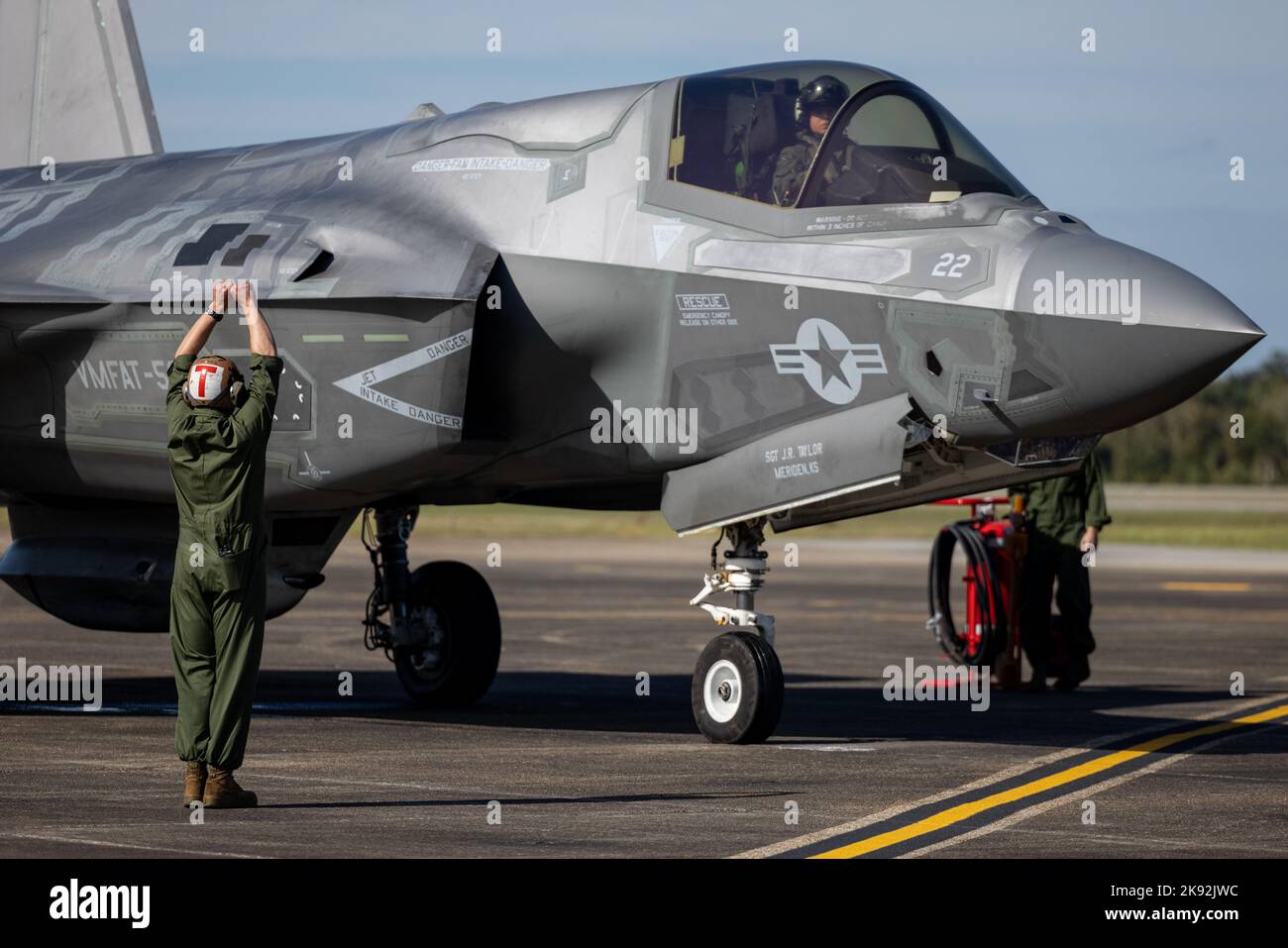 U.S. Marine Corps Sgt. Jordan H. Williams (left), a fixed-wing aircraft ...
