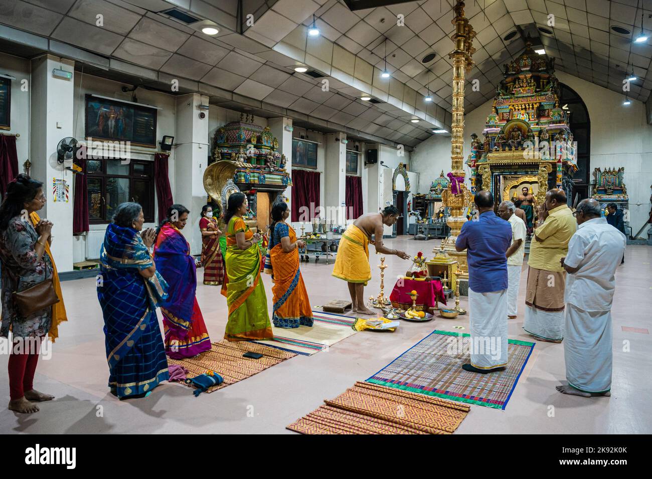 A puja ceremony is conducted by a pandit or Hindu Priest on Diwali ...