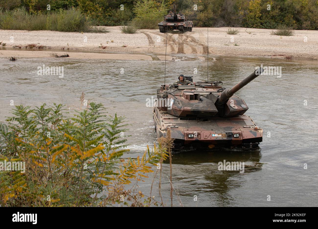 Two Leo2 A6 HEL, assigned to the Hellenic XXV Armored Brigade cross a ...