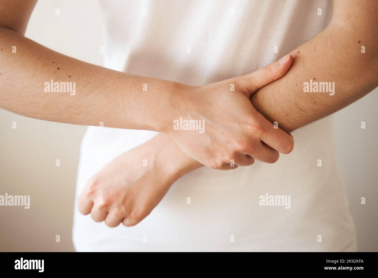 Hand injury. Beautiful girl with pain and bruise in her arm due to an ...