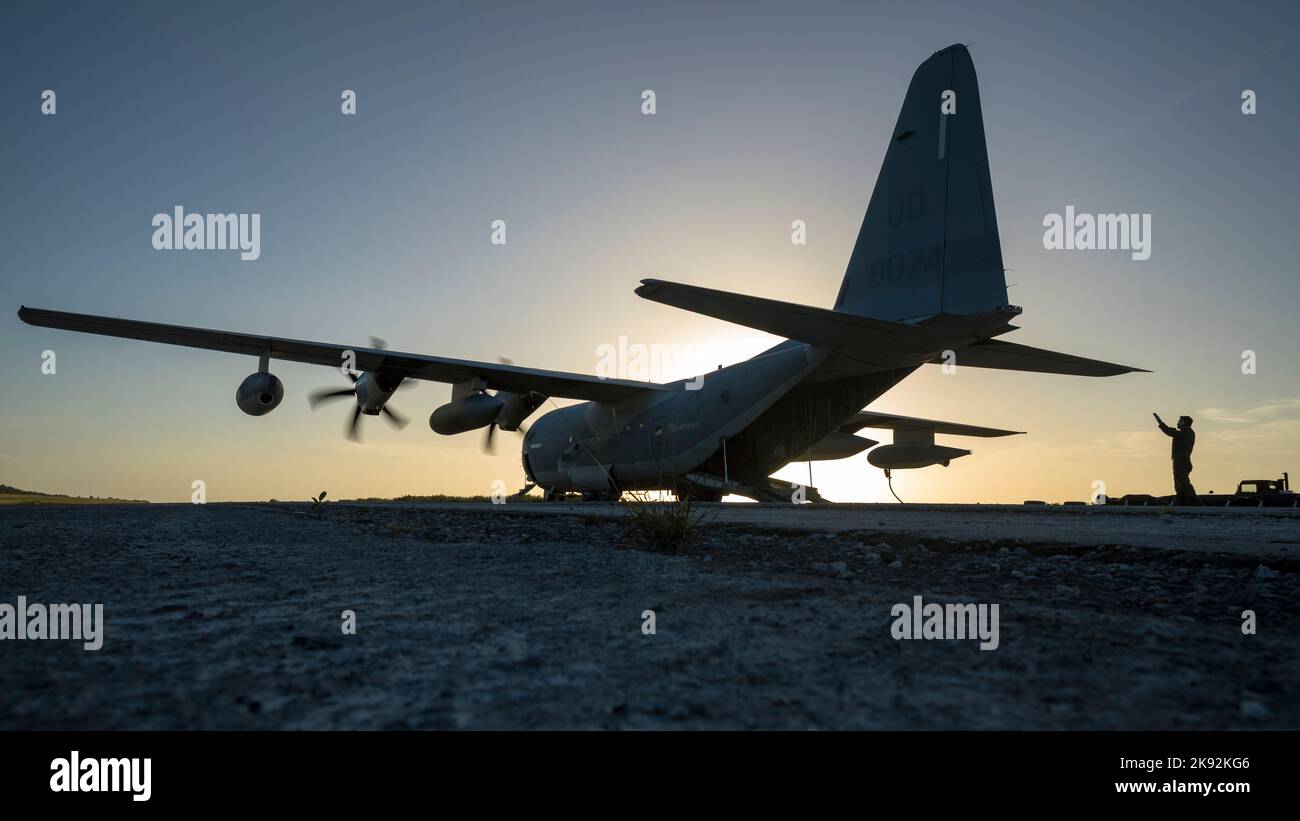 U.S. Marines with Marine Aerial Refueler Transport Squadron (VMGR) 152 prepare to unload cargo ...