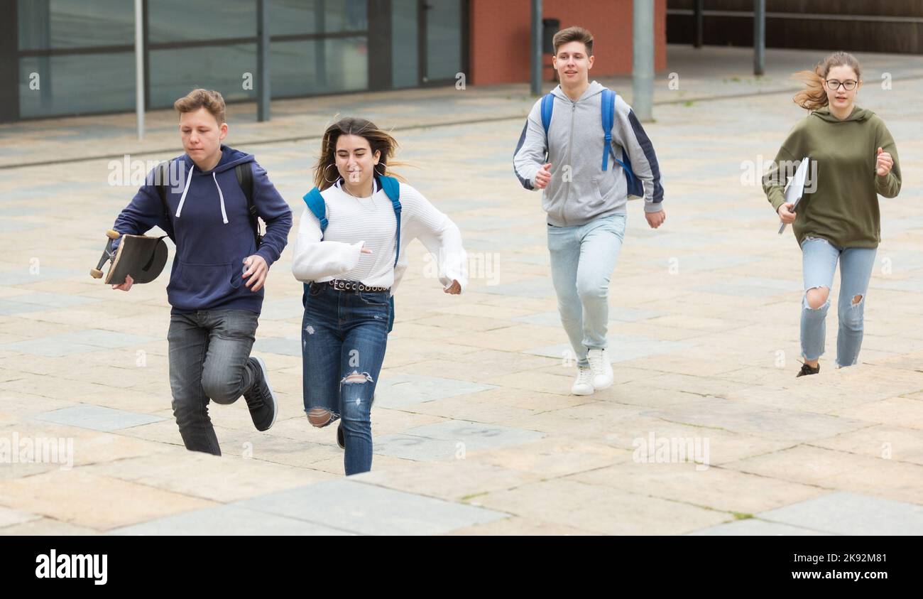 Teenager school kids running Stock Photo - Alamy