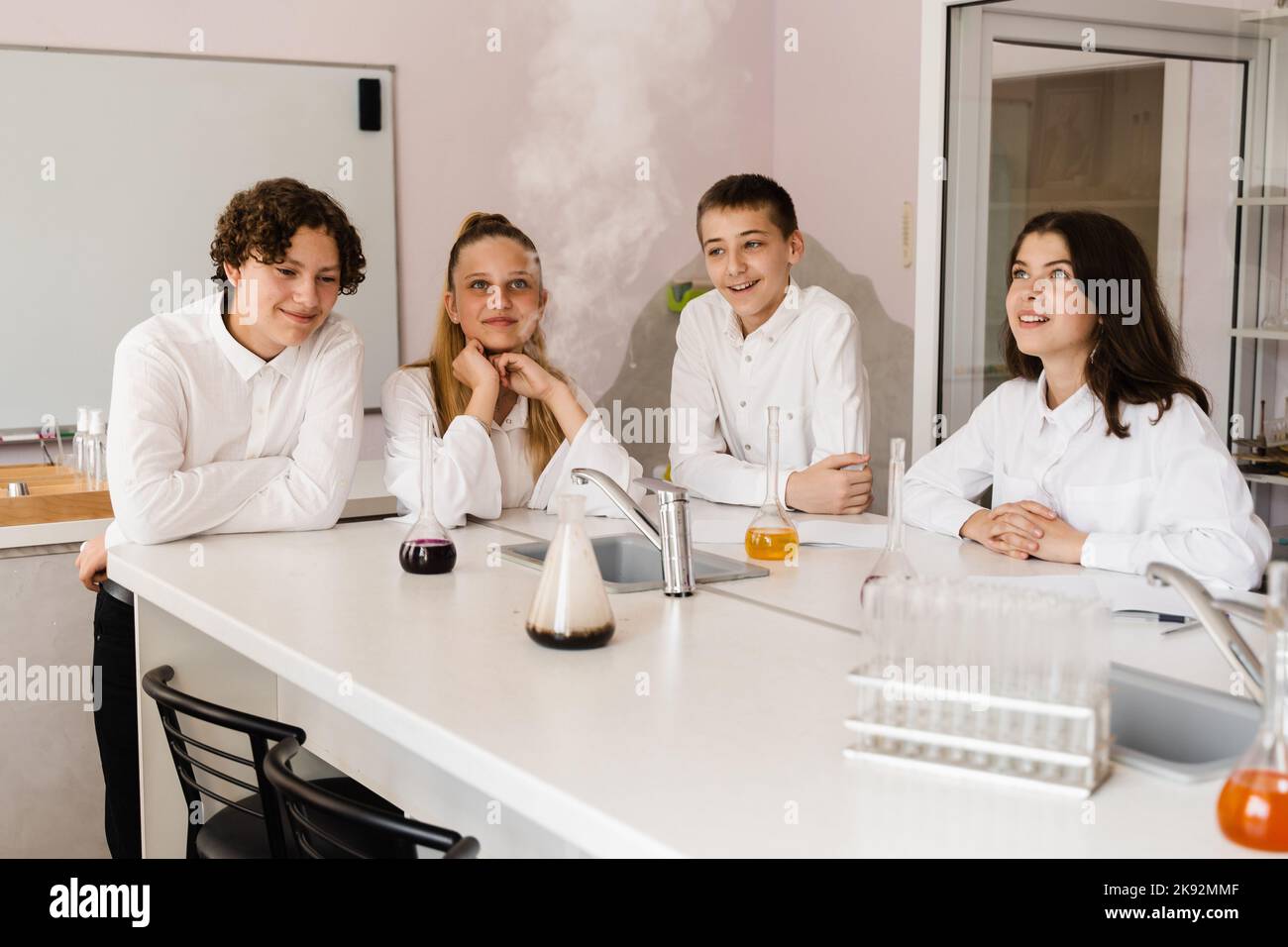 Volcano experiment. School chemistry teacher shows children experiments ...