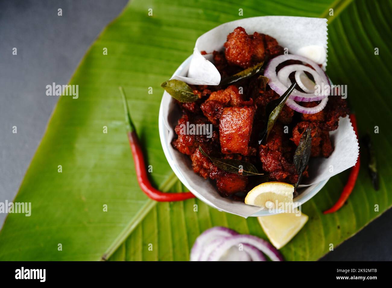 Homemade chicken 65 or chilli chicken fry served in a bowl, selective ...
