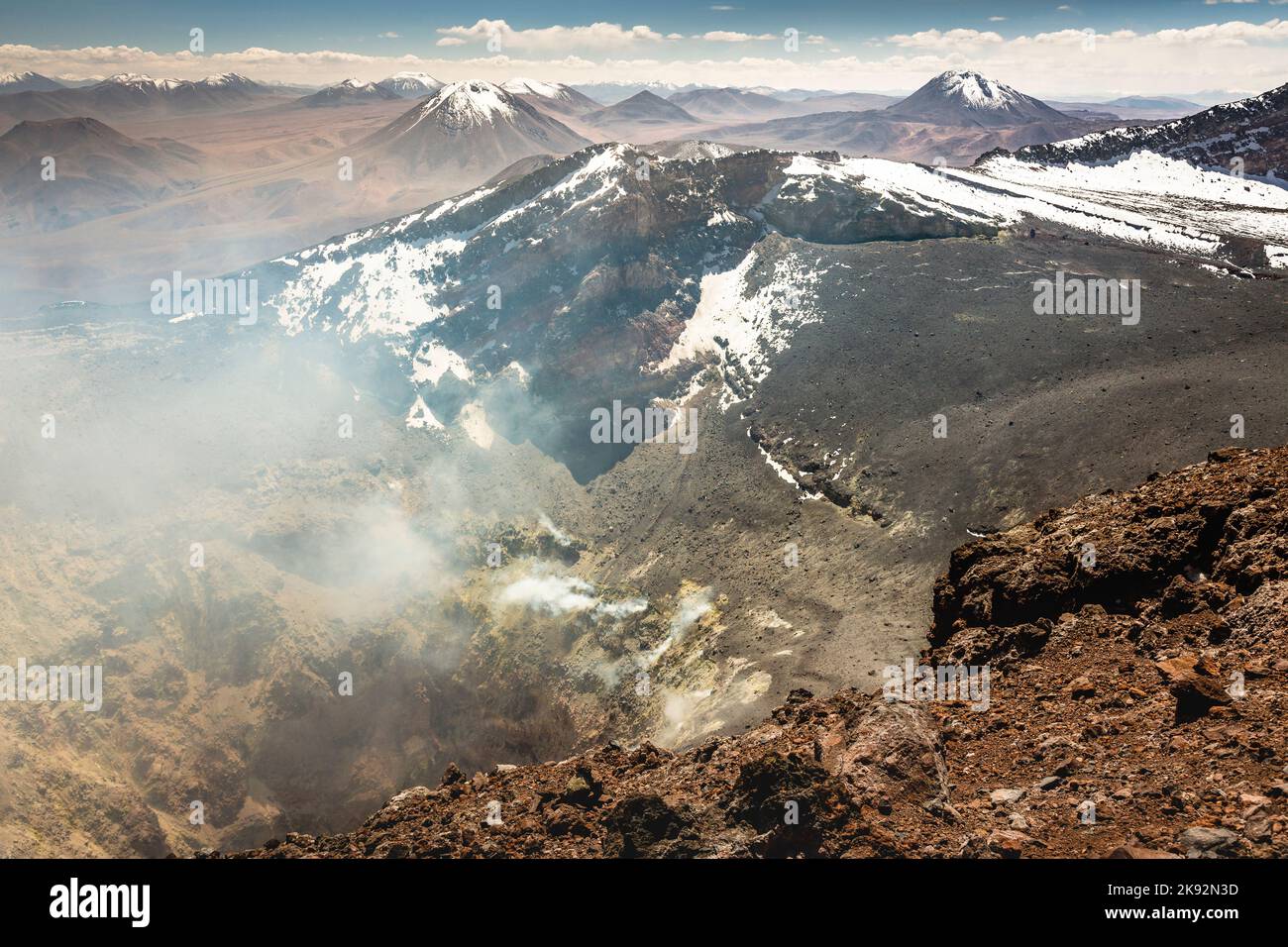 Atacama desert, snowcapped Lascar volcano crater and arid landscape in ...
