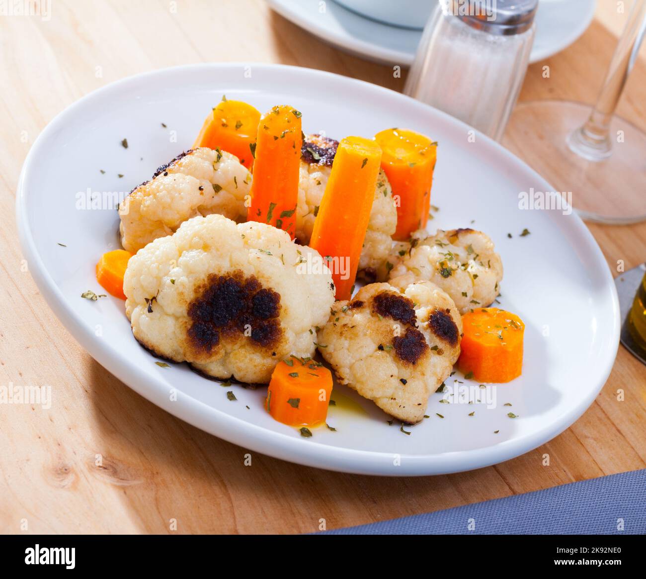 Cauliflower and carrots on the plate Stock Photo - Alamy