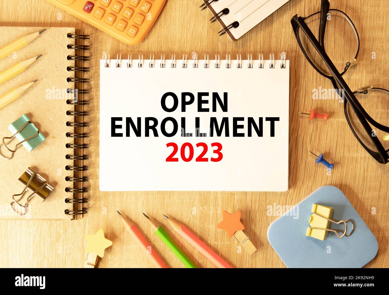 Open Enrollment. Text and a man's hand holding a black marker on a ...