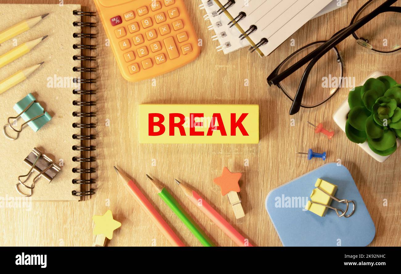 Color notes with letters pinned on a board. Word BREAK. Work space ...