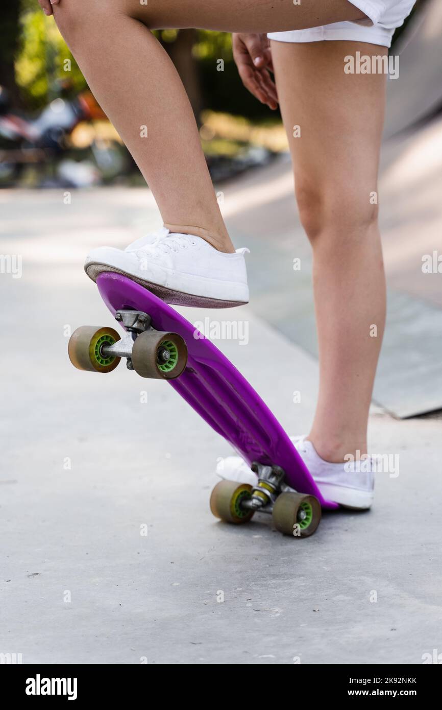 Child girl ride on penny board close up. Sports equipment for kids ...
