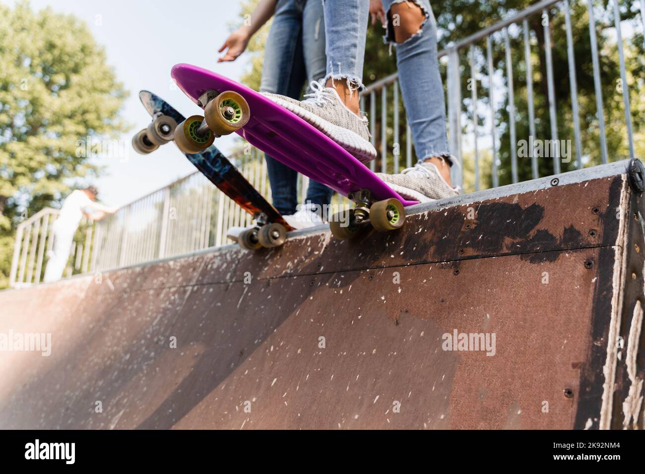 Children girls friends ready for ride on penny board on skateboard park ...