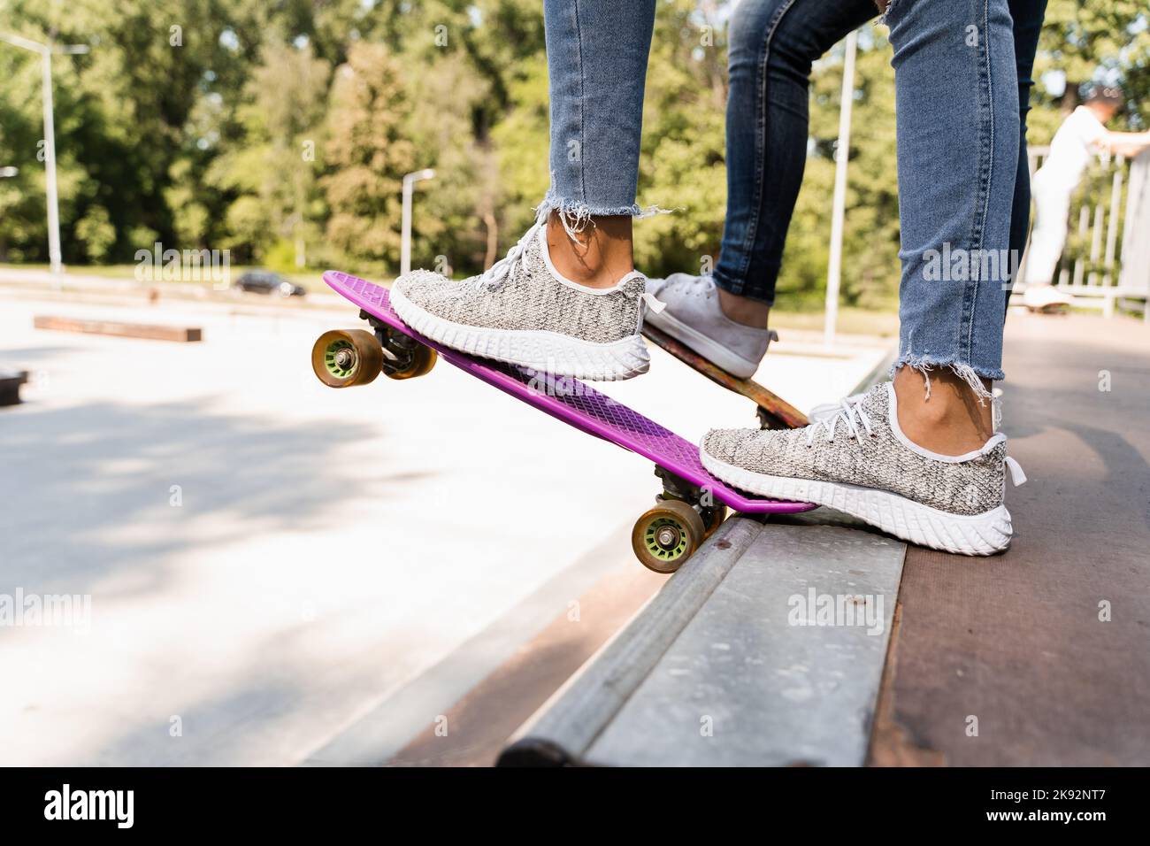 Children girls friends ready for ride on penny board on skateboard park ...