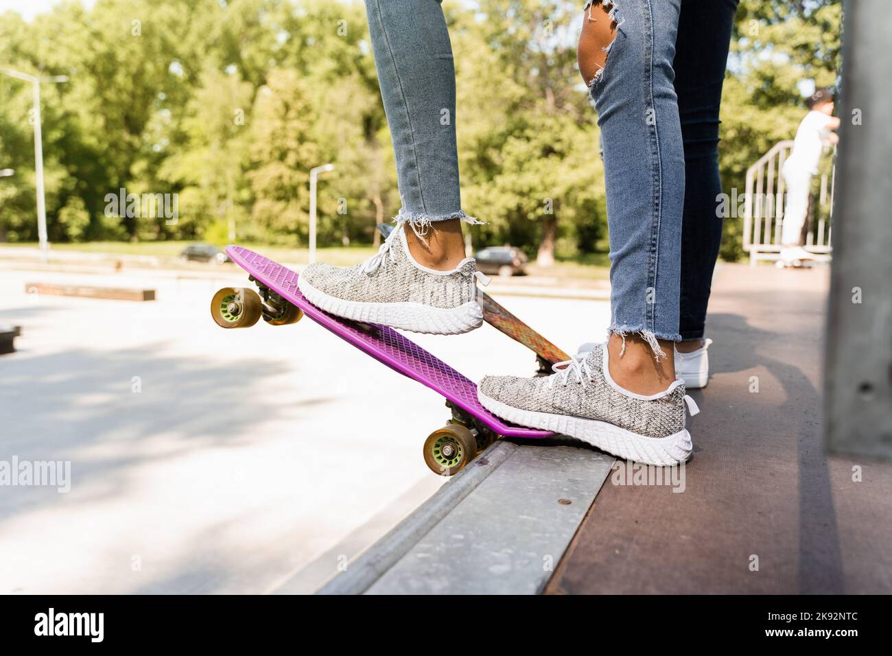 Children girls friends ready for ride on penny board on skateboard park ...