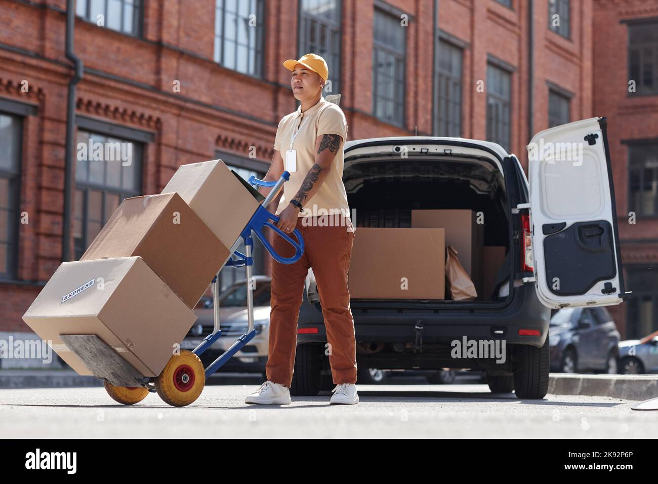 Worker unloading boxes hi-res stock photography and images - Alamy