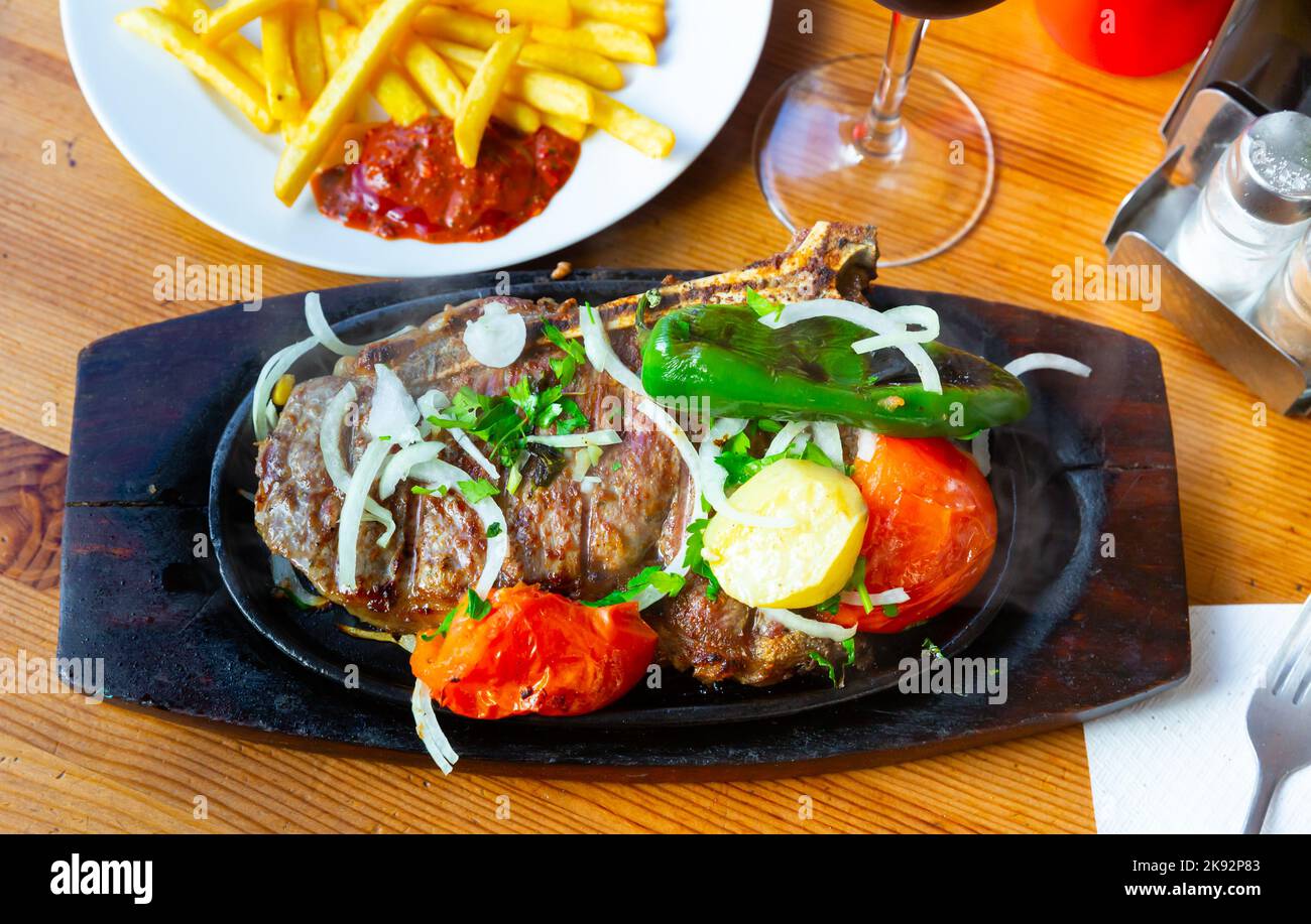Delicious grilled beef steak with potatoes and vegetables Stock Photo ...
