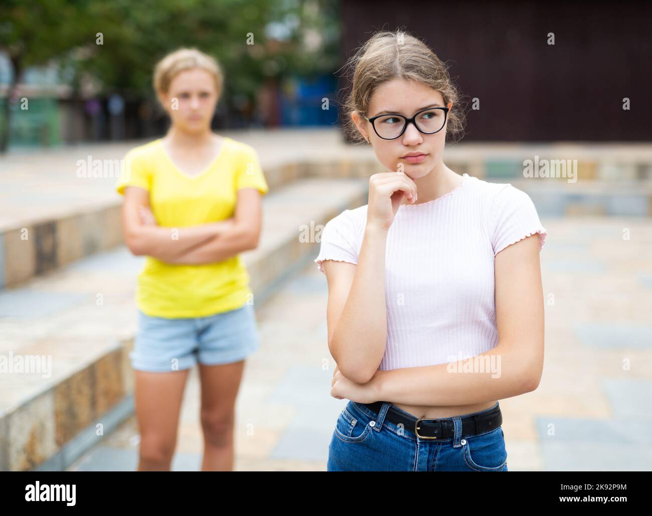 Youth girls quarreling between each other outdoors Stock Photo - Alamy