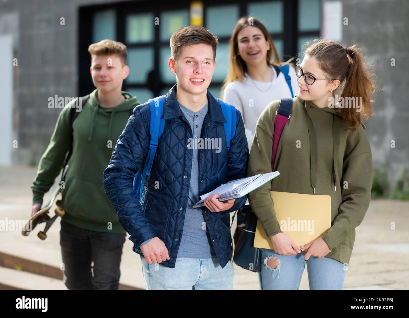 Carefree teen students boy and girl friendly talking Stock Photo - Alamy