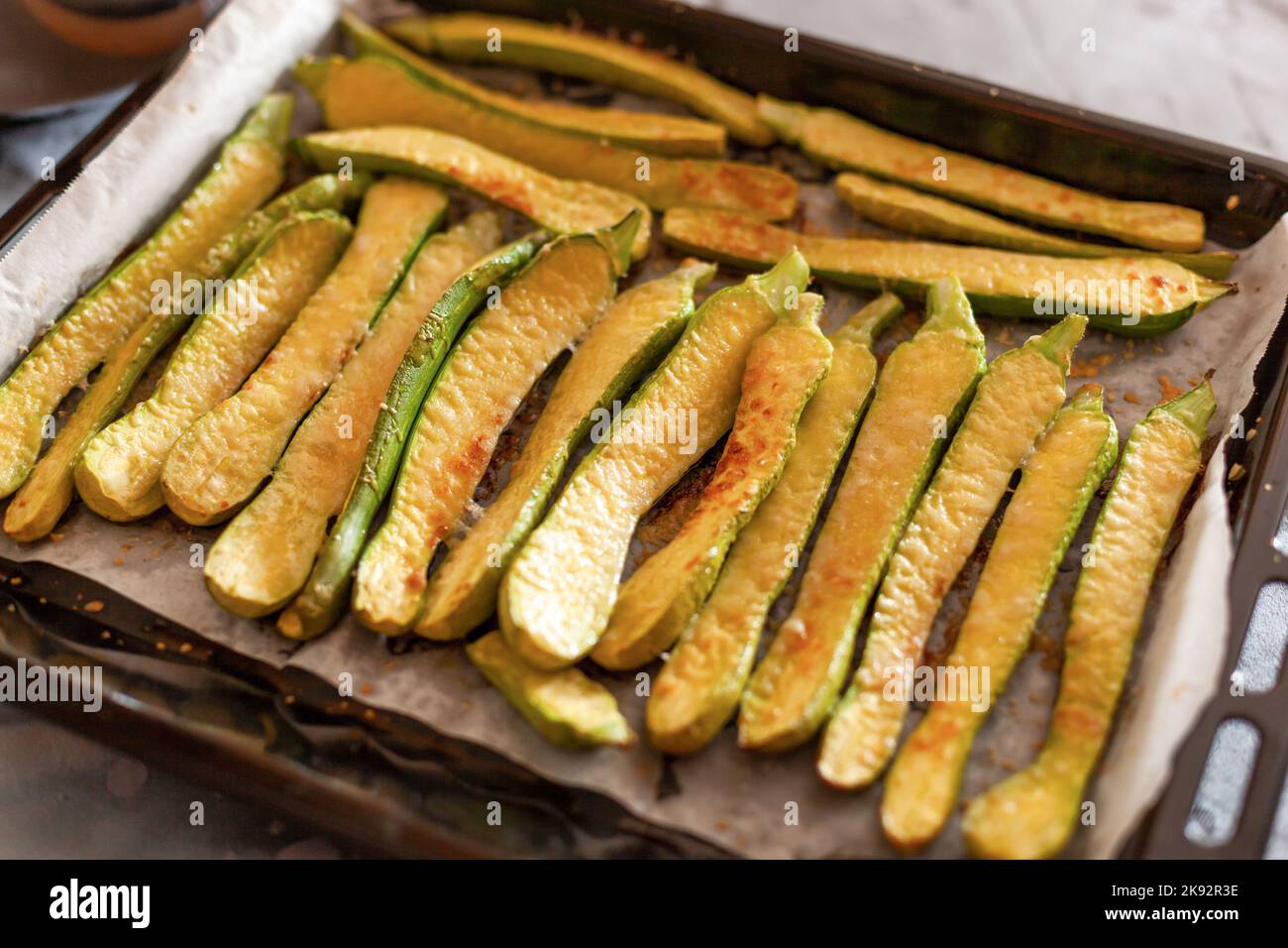 mini zucchini roasted with parmesan cheese, side view Stock Photo - Alamy