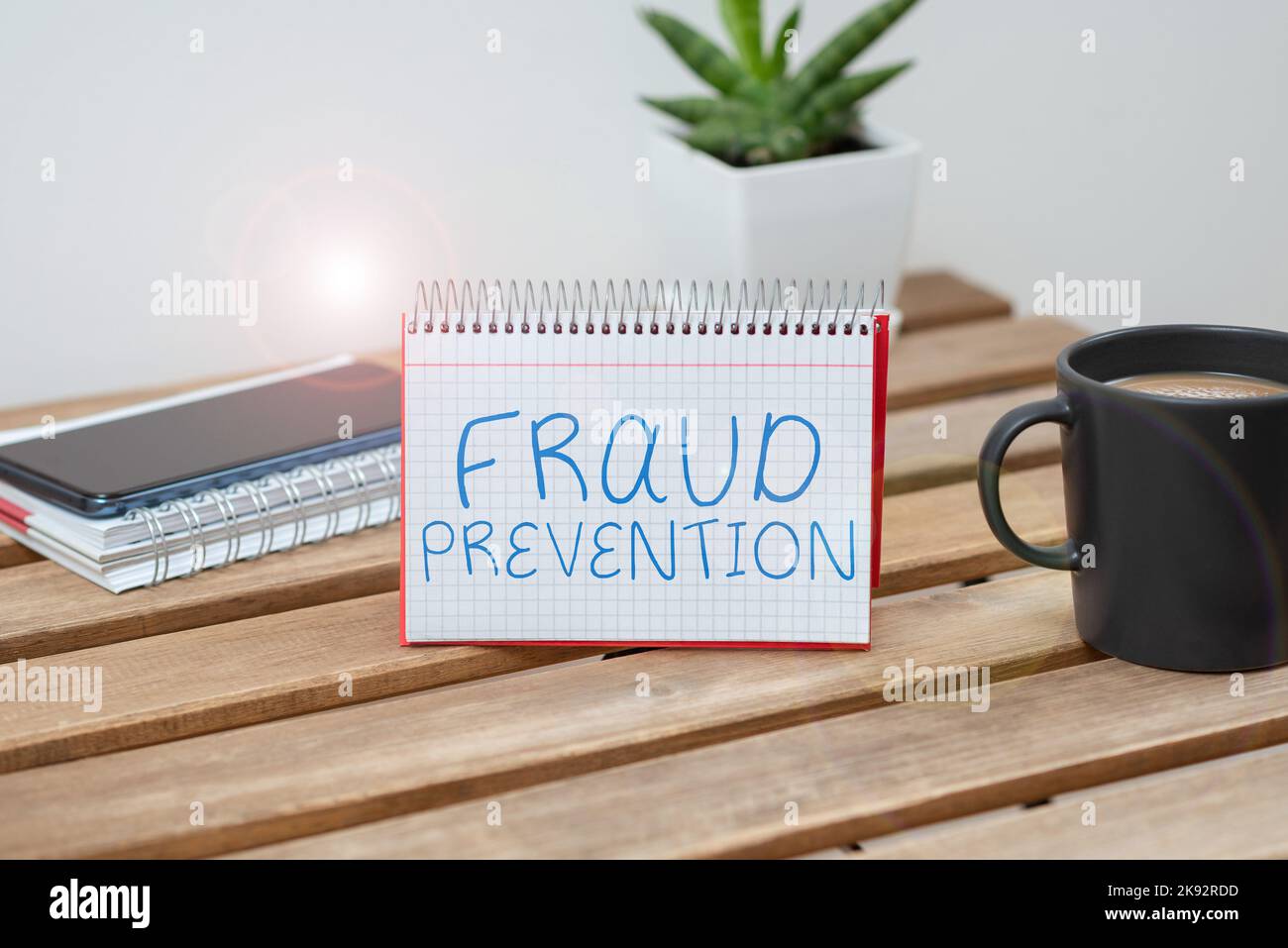 Hand writing sign Fraud Prevention. Word Written on to secure the ...