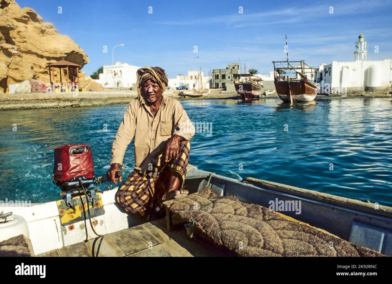 Sur, Oman - December 1, 1992: man offers his ferry services to ...