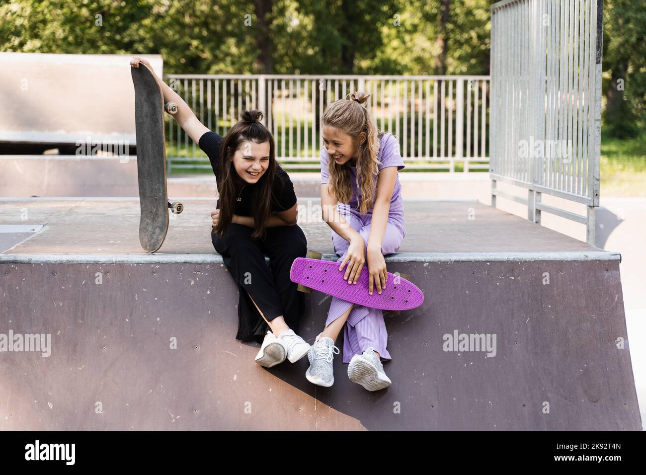 Kids girls smile and laugh and have fun together. Children with ...