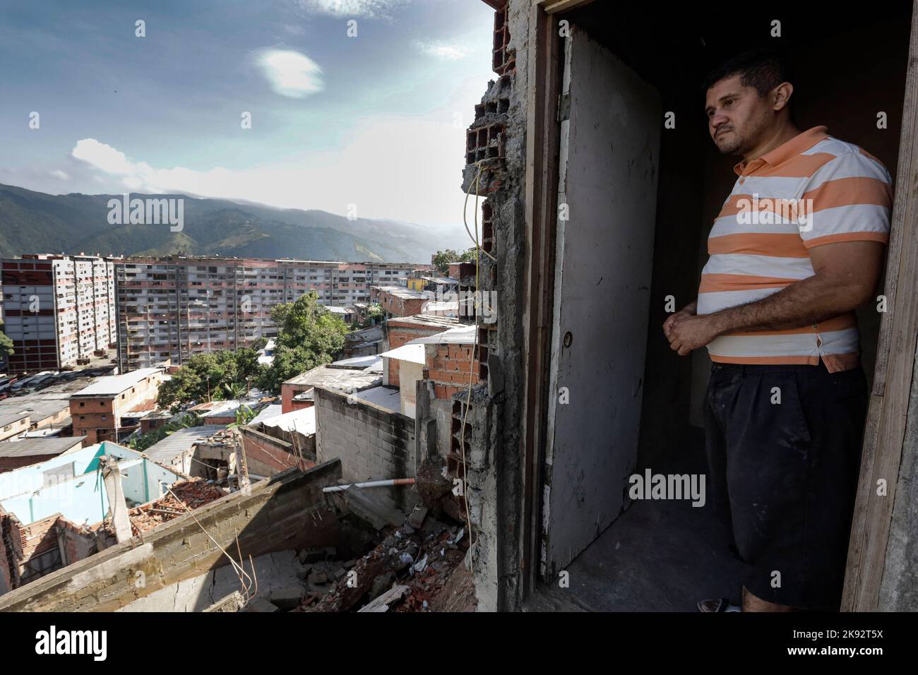 Caracas, Venezuela. 25th Oct, 2022. A man looks at the remains of his ...