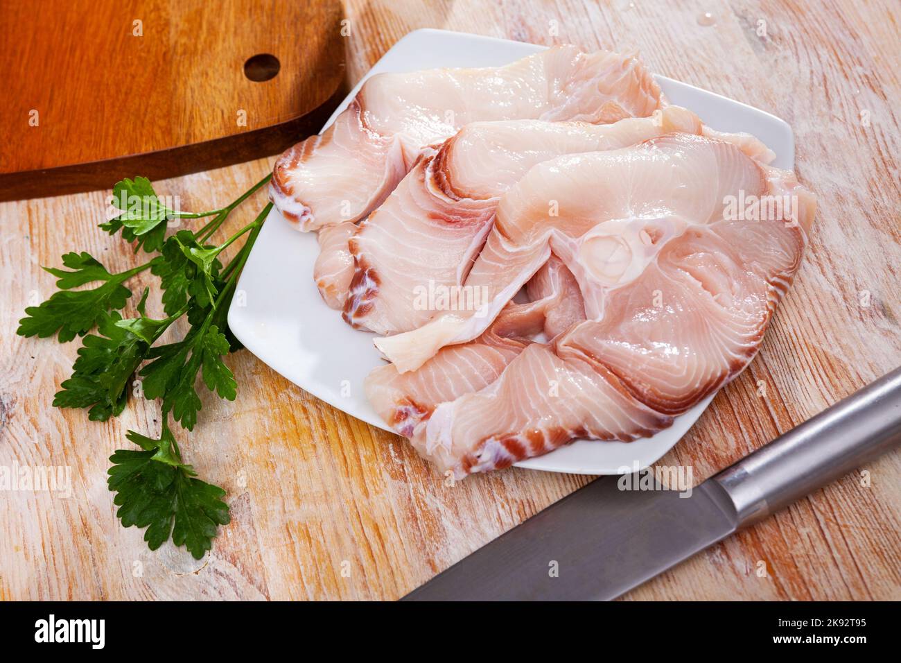 Raw seafood, fresh tiger shark fillet on board Stock Photo - Alamy