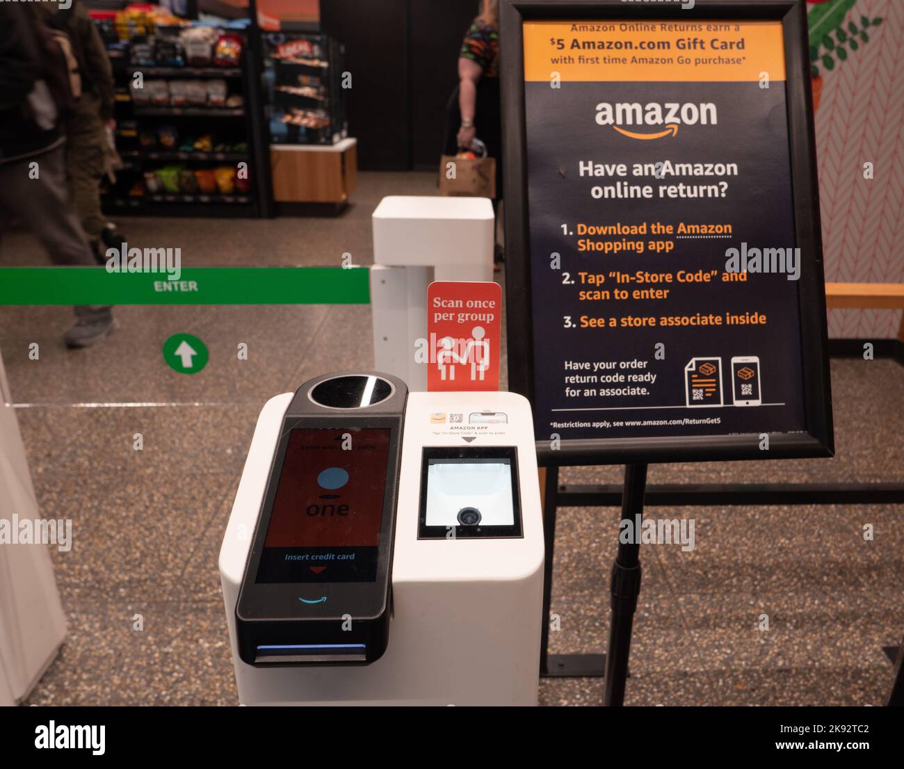 The entrance of the Amazon Go store where a scanner device let’s ...