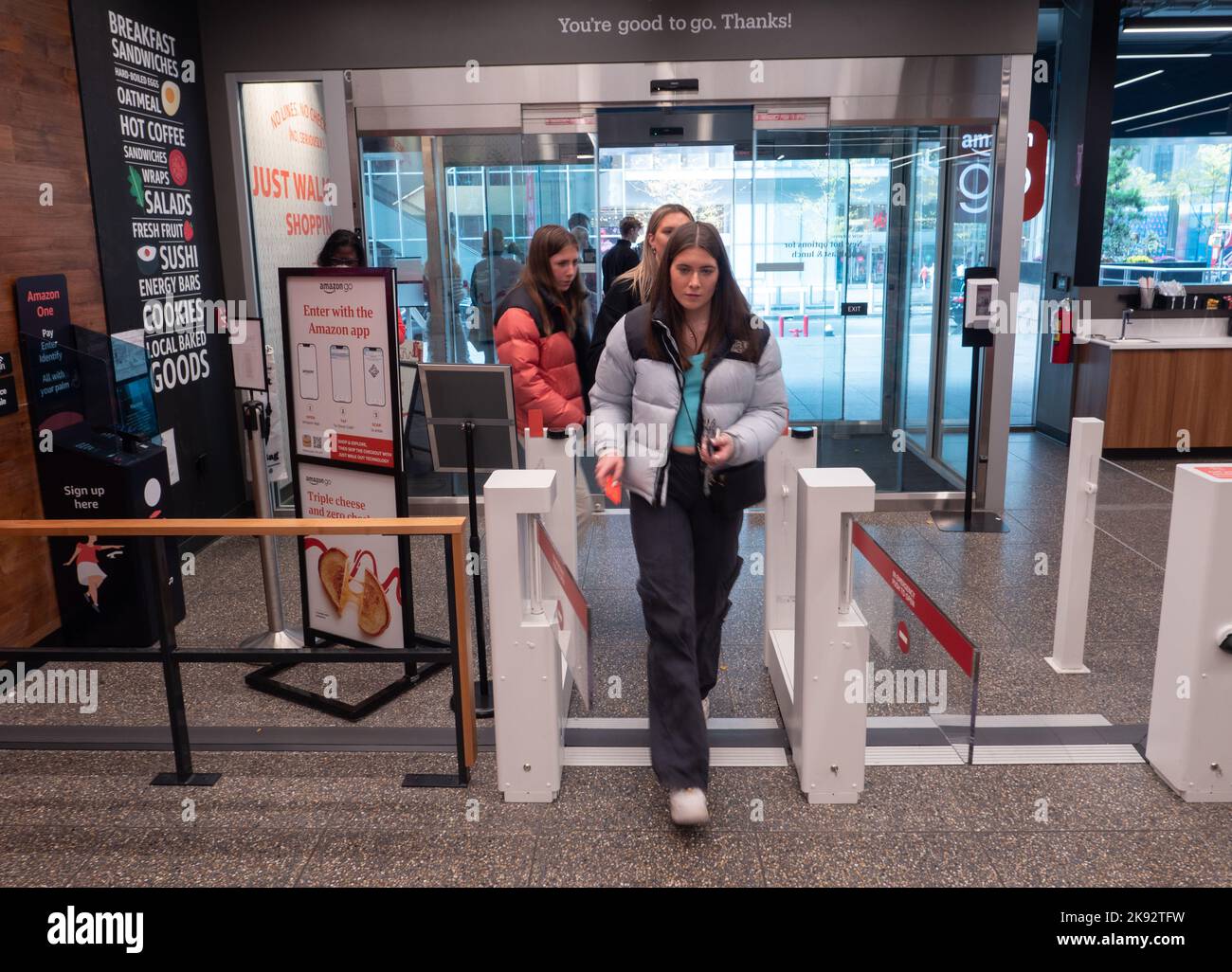 Shoppers enter through a turnstile of the Amazon Go store in New York ...