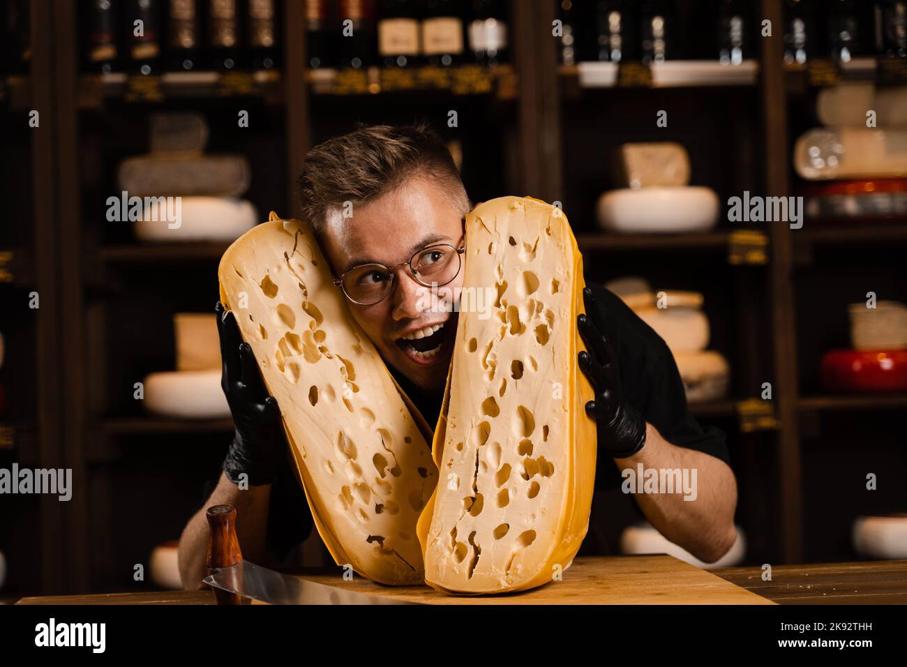 Funny crazy cheese sommelier with 2 pieces of limited maasdam natural ...
